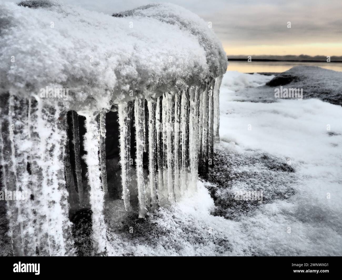 Ice icicles hanging down. Northern arctic winter season. Frozen nature ...