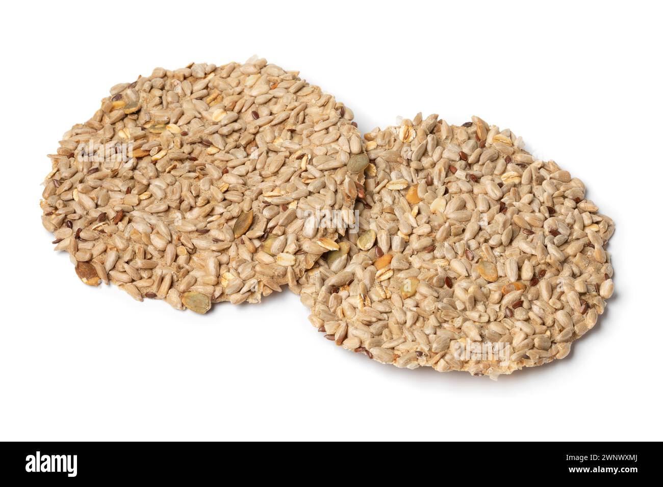 Pair of fresh baked homemade crispy oat crackers close up isolated on ...