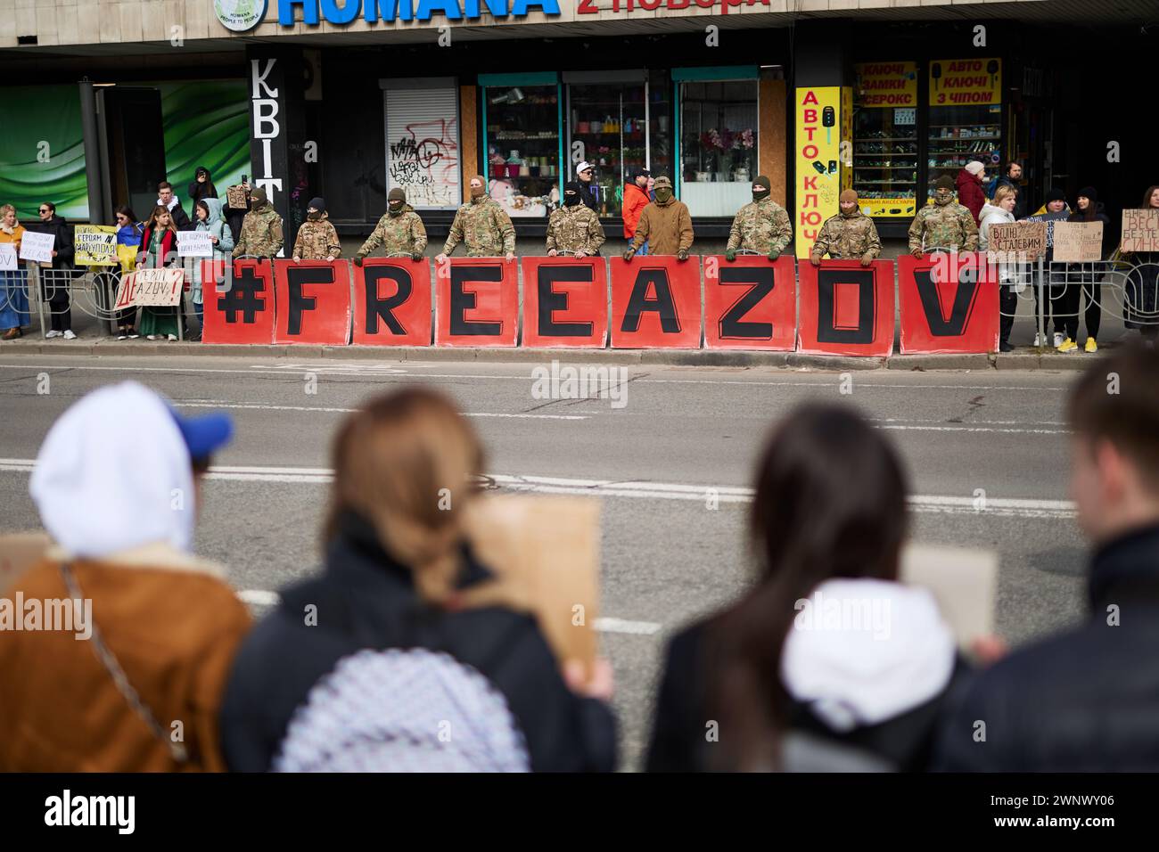 Ukrainian soldiers hold large banner "Free Azov" on a peaceful ...