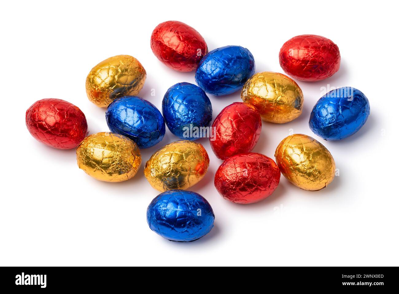 Heap of chocolate easter eggs in colorful tinfoil close up isolated on ...