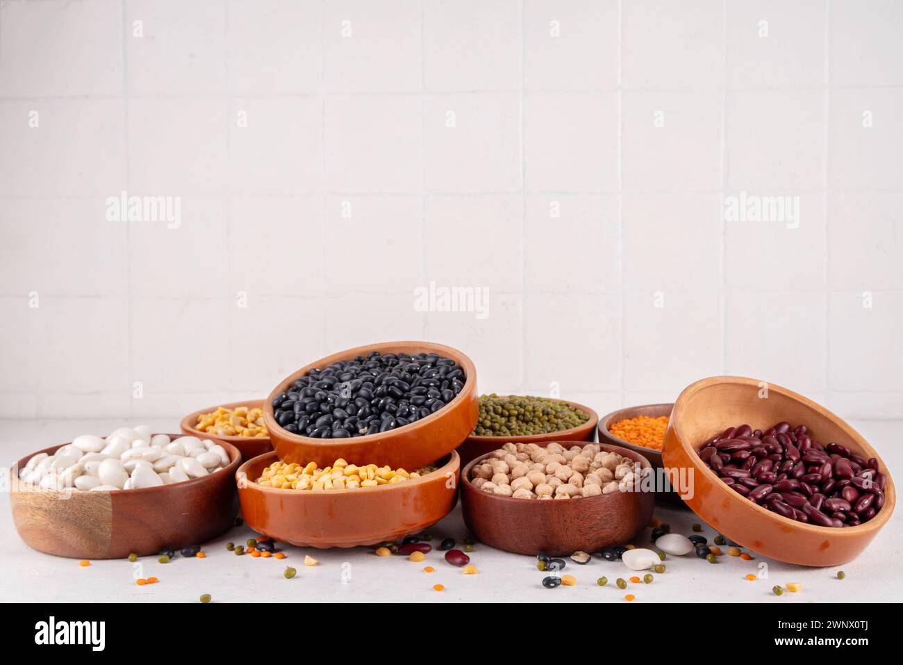Various dried beans, lentils, mung, chickpea, pea assortment in wooden ...