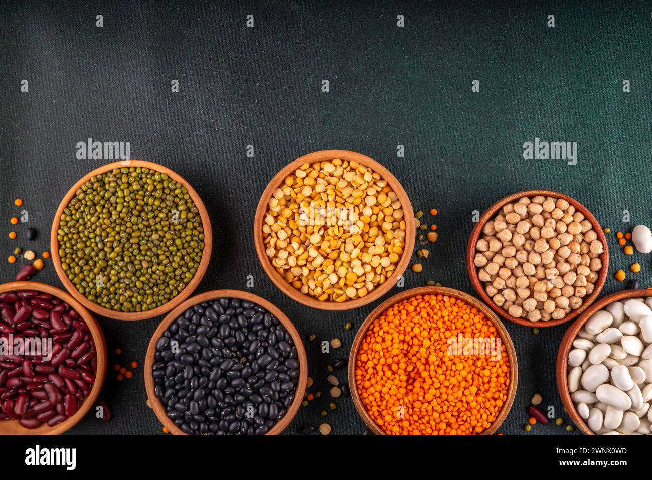 Various dried beans, lentils, mung, chickpea, pea assortment in wooden ...