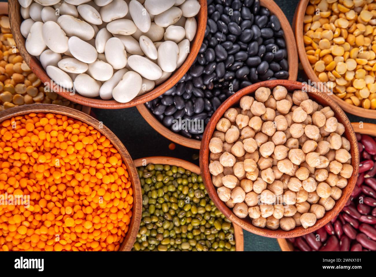 Various dried beans, lentils, mung, chickpea, pea assortment in wooden ...