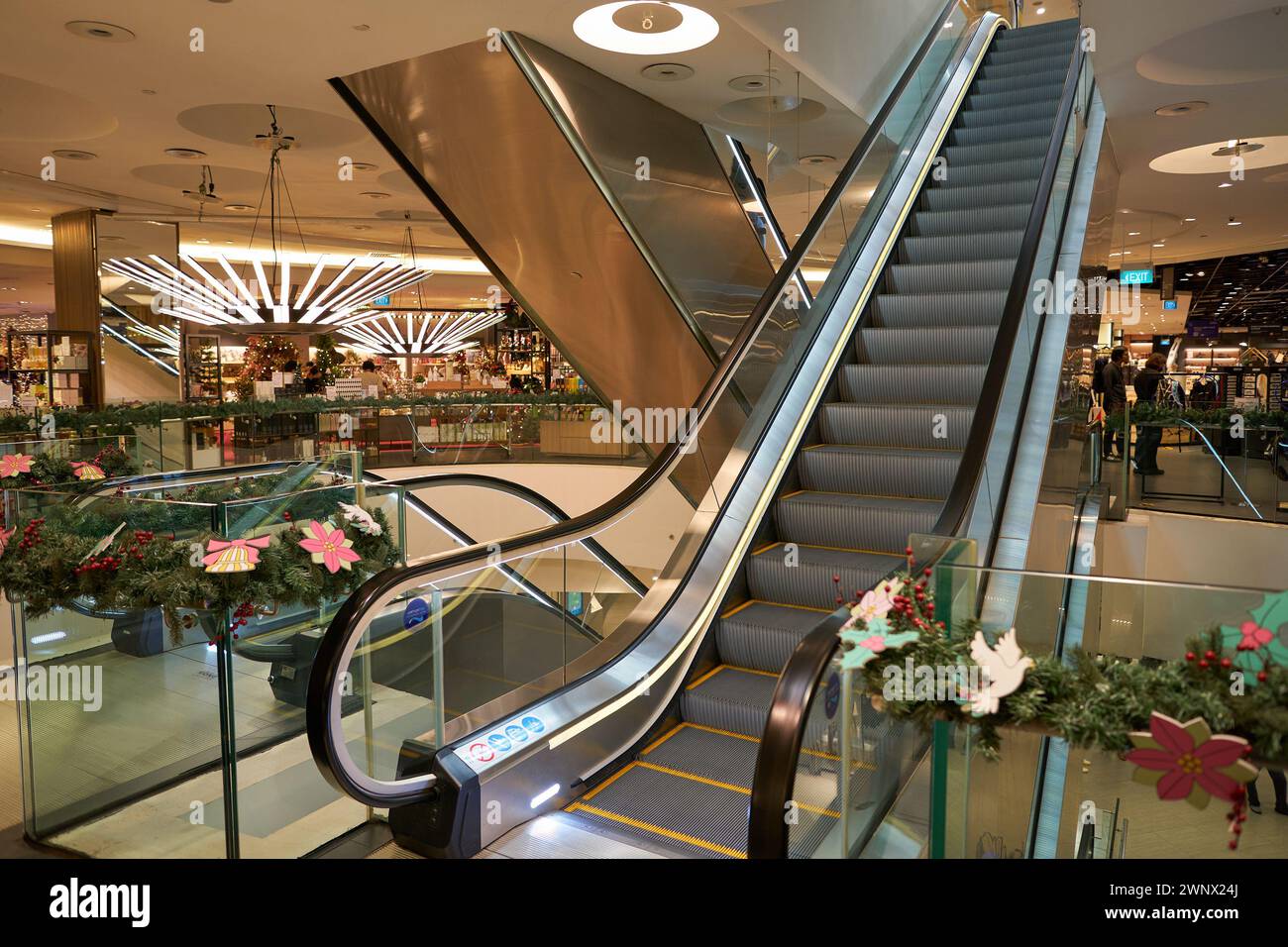 SINGAPORE - NOVEMBER 06, 2023: an escalator at Tang Plaza in Singapore ...