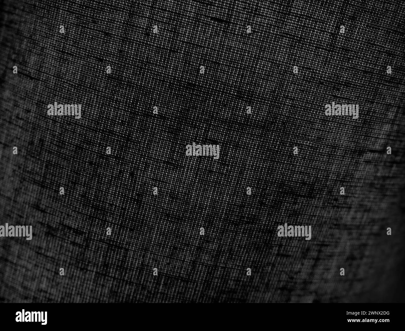 background of black linen or cotton fabric with coarse threads ...