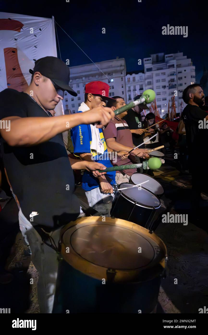Buenos Aires, Argentina. 1st Mar, 2024. Protesters play drums and chant ...
