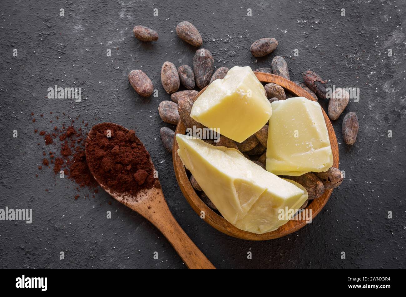 Cocoa butter or Cocoa bean solid oil and raw cocoa beans on rustic ...