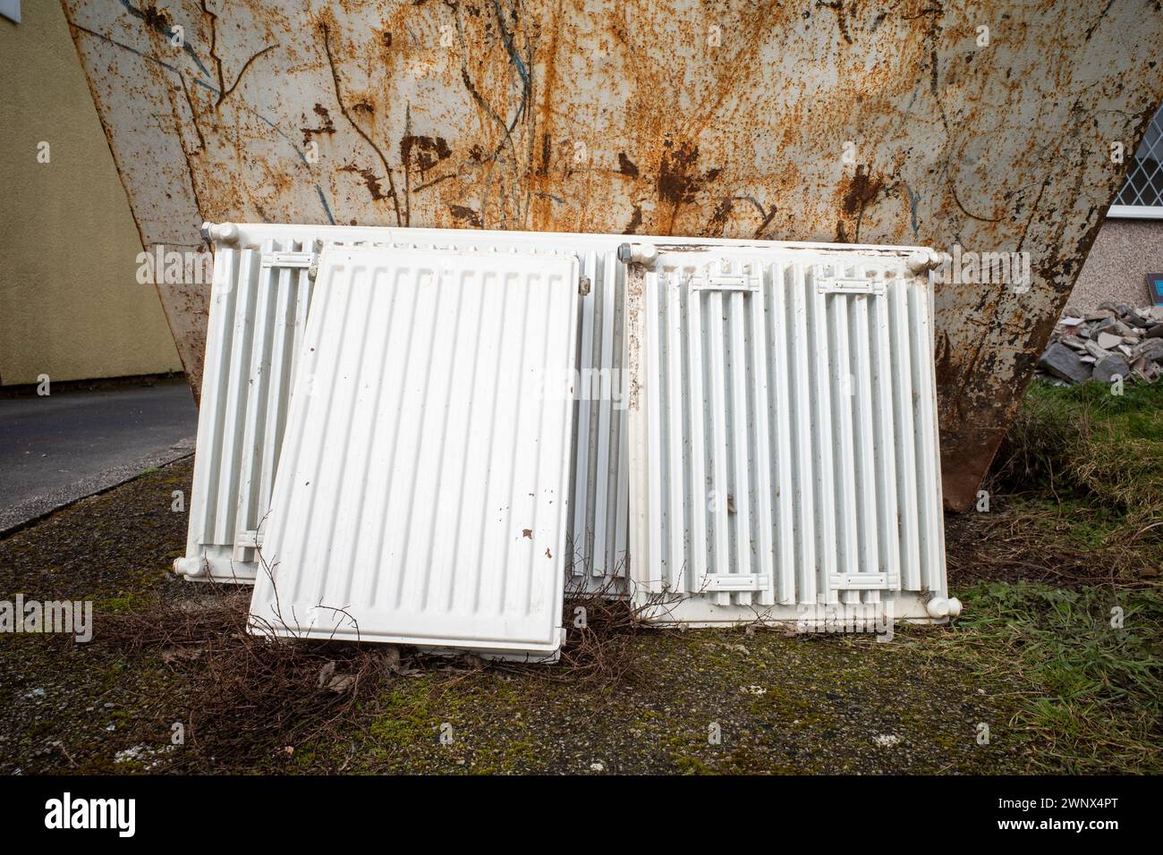 Abandoned white radiators left outside a house being renovated Stock ...