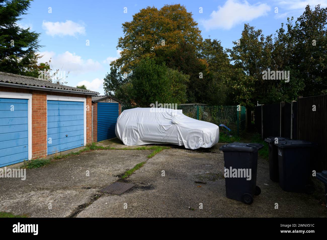 A car under a car cover Bardwell Close, Basingstoke, Hampshire, UK. 24 ...