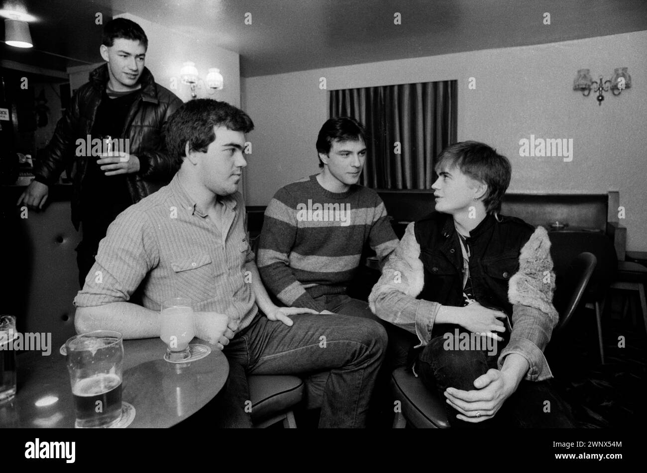 Unemployed young adults men chatting in a Windscale village pub ...