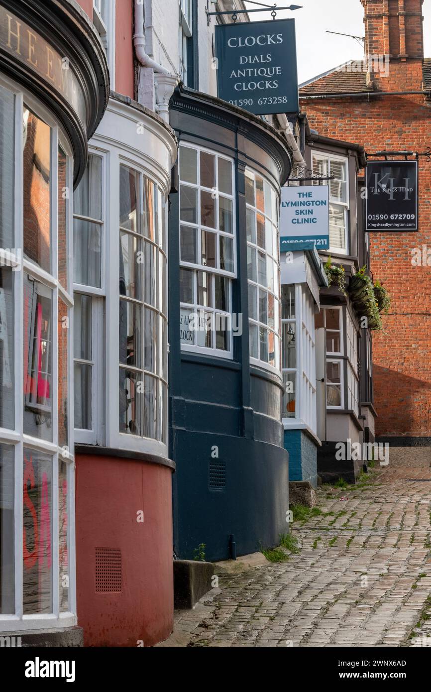 georgian bay window shop fronts on an old street in the new forest town ...
