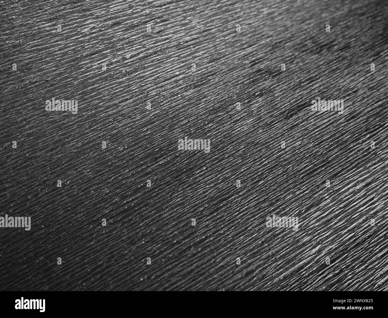 Black or gray corrugated paper. Uneven surface. Abstract monochrome ...