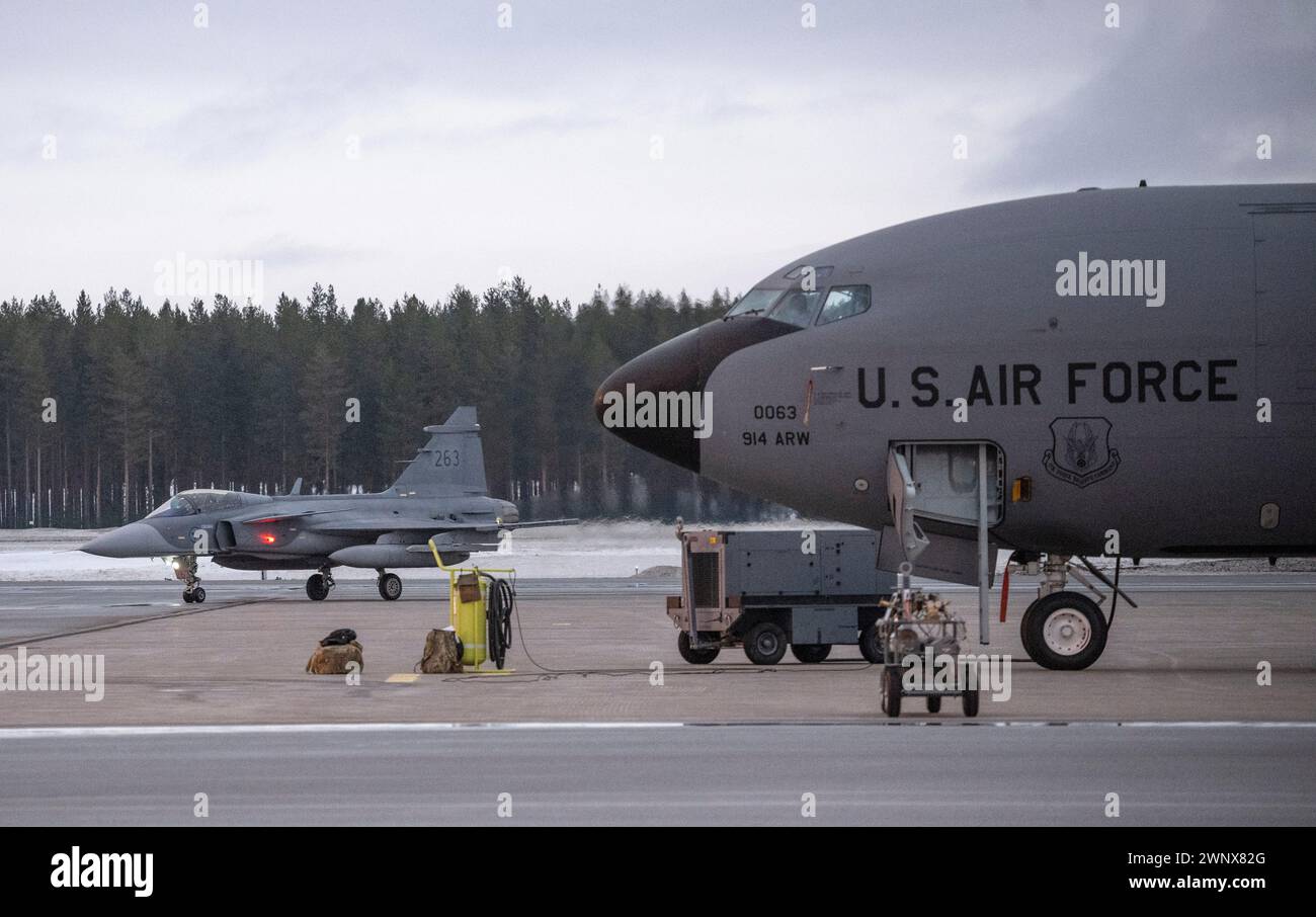 KALLAX, Sweden. , . A JAS 39 Gripen C/D passes a US KC-135 Stratotanker ...