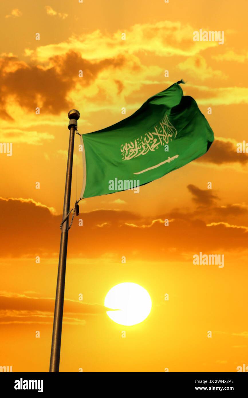 Saudi Arabia national flag waving at sunset. Islamic religion flag ...