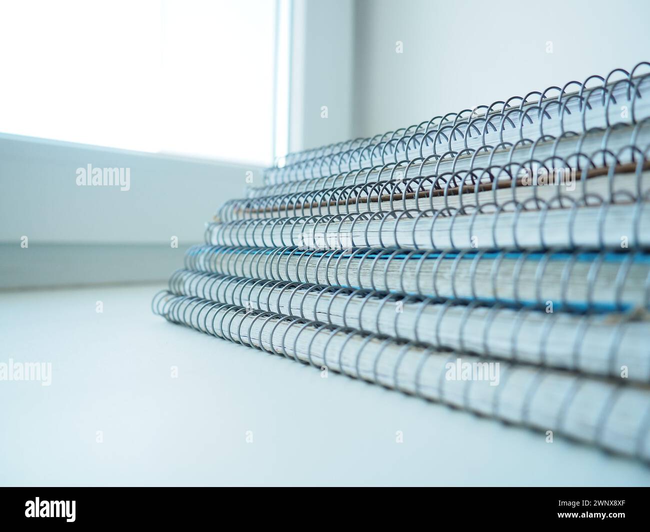 A stack of spring notebooks. Thick notebooks or notebooks placed on top ...