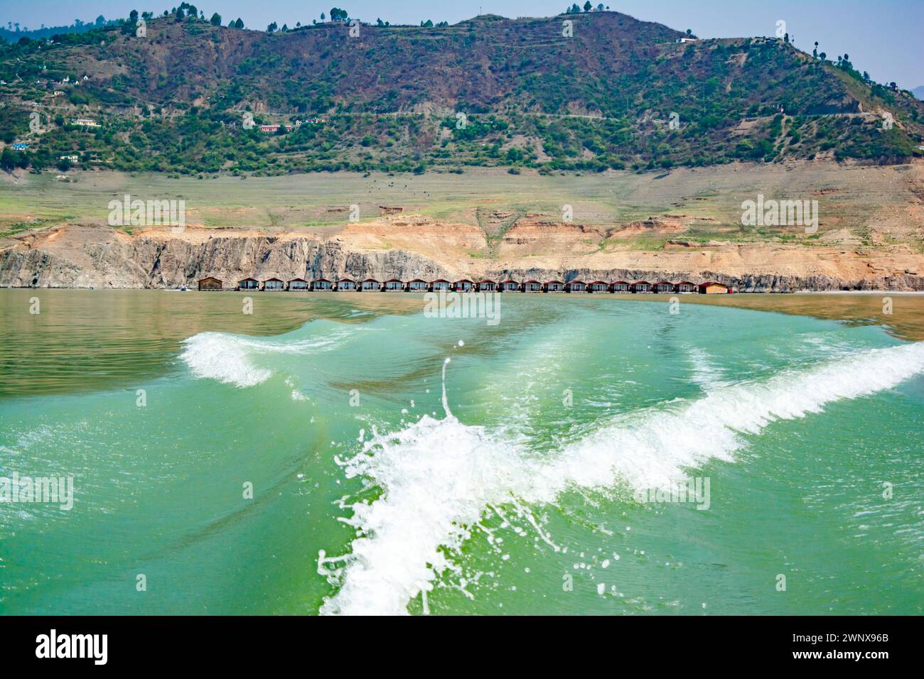 Tehri Lake, water surface behind of fast moving motor boat in Tehri ...