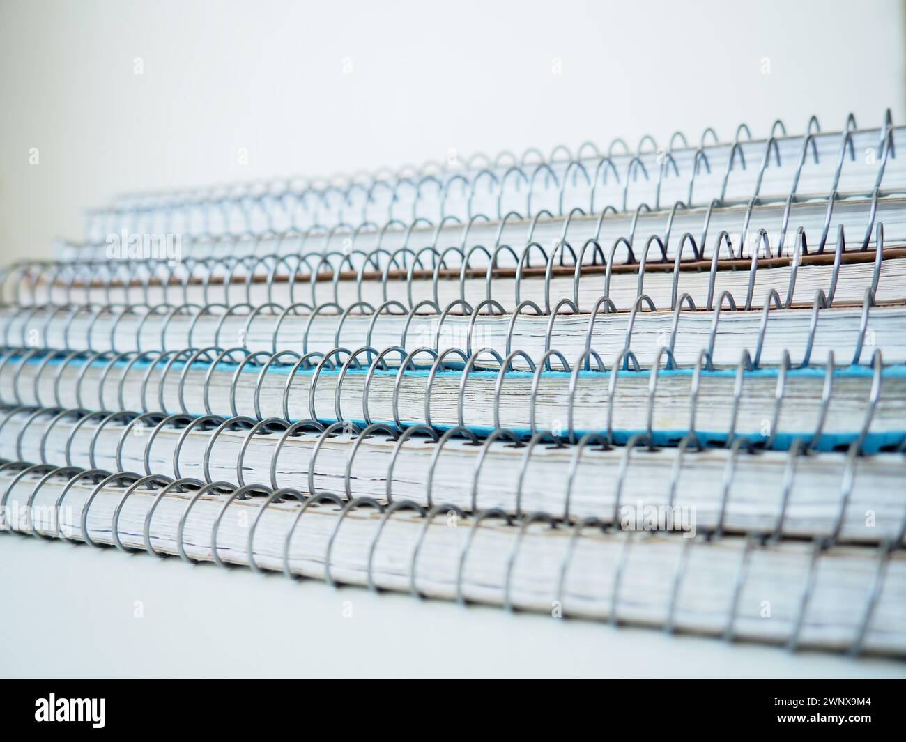 A stack of spring notebooks. Thick notebooks or notebooks placed on top ...