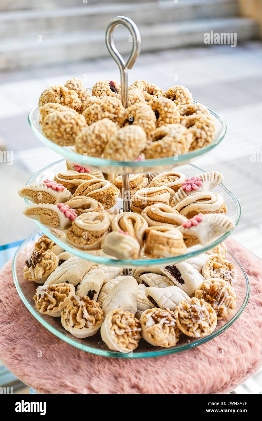 Vertical photo an inviting three-tiered stand overflows with an ...