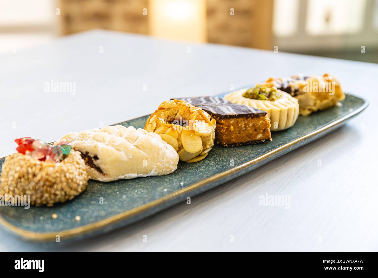 Horizontal photo an elegant spread of mixed Arabic sweets, featuring ...