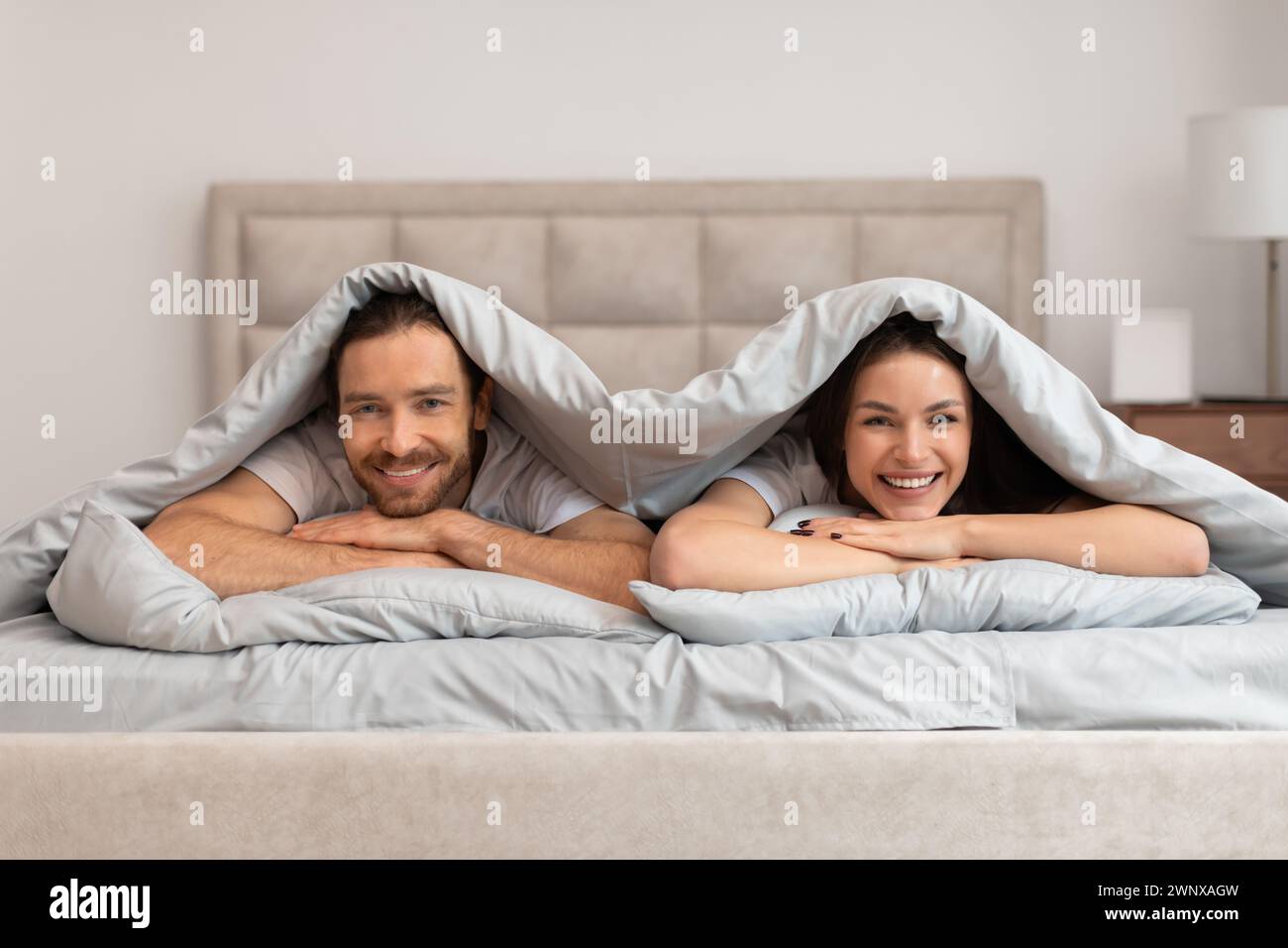 Couple under sheets hi-res stock photography and images - Alamy