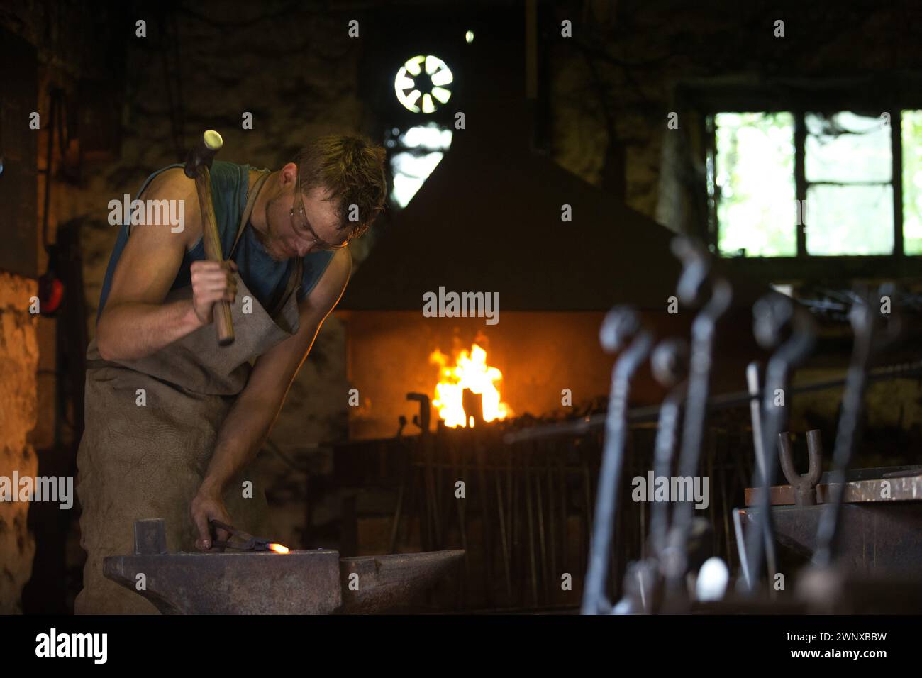 01/07/15 Blacksmith Daniel Hawker at Mill Forge, Caudwell's Mill, Rowsley Stock Photo - Alamy