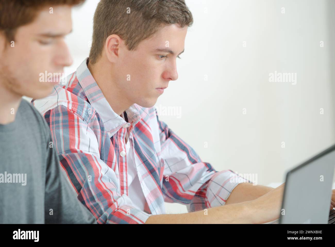 two young men on information tech Stock Photo - Alamy