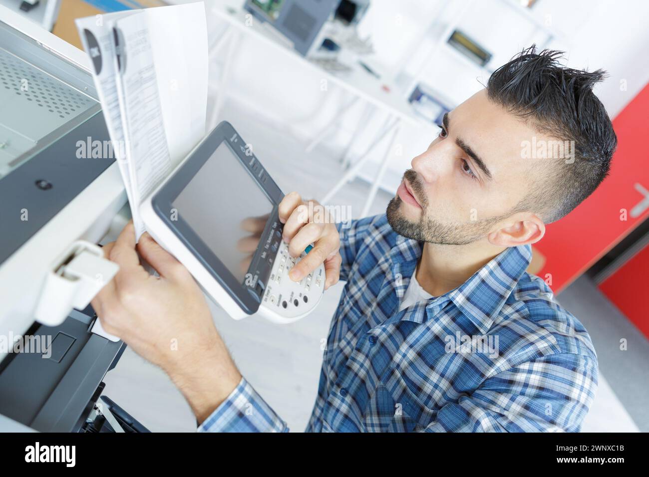 Person checking technical device hi-res stock photography and images ...