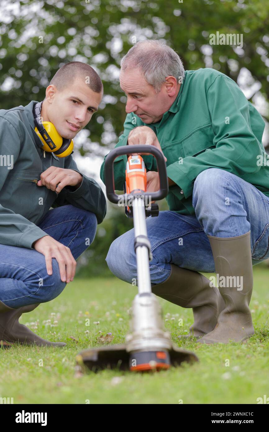 men with gardening tools outdoors Stock Photo - Alamy