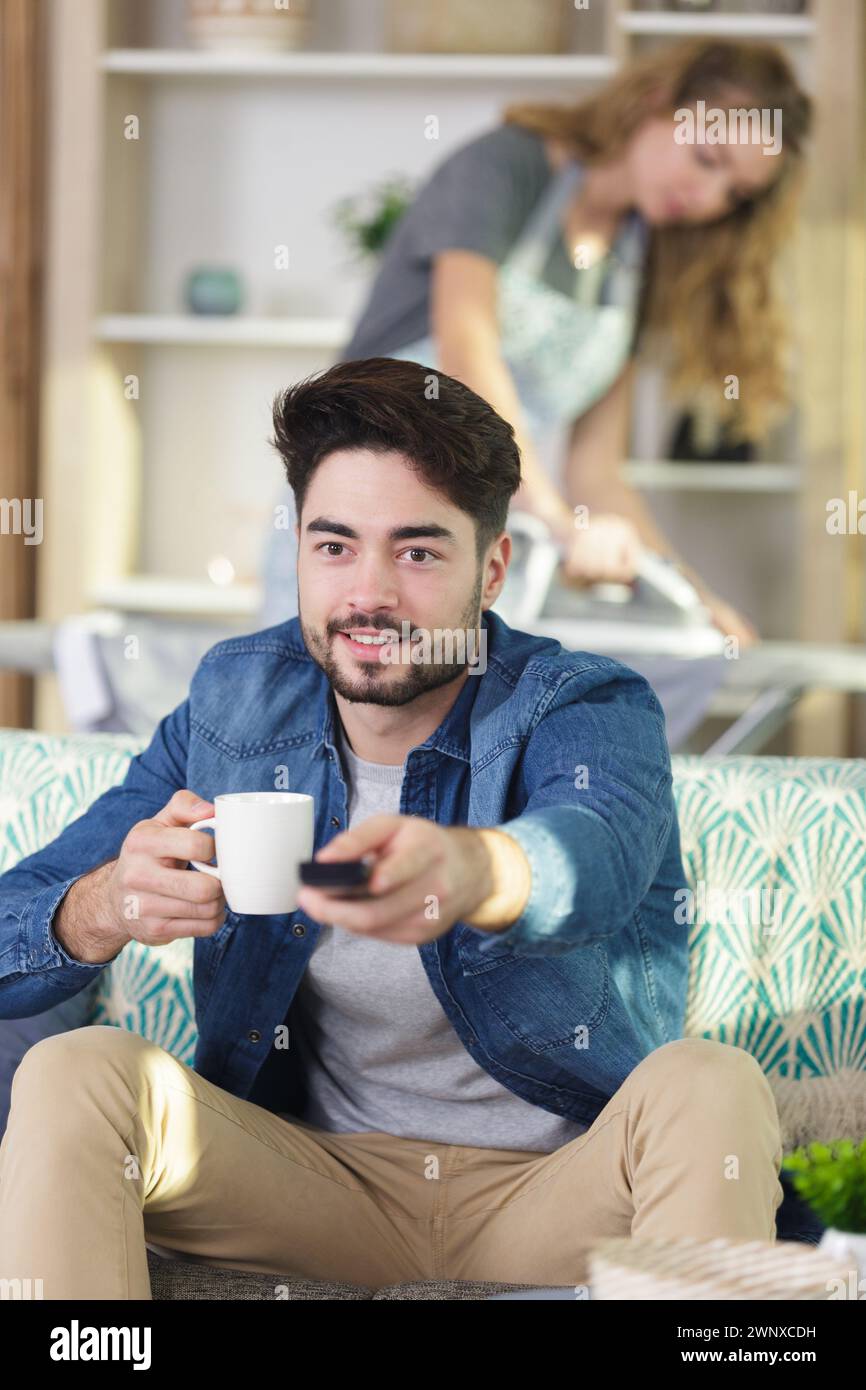 Woman ironing tv hi-res stock photography and images - Alamy