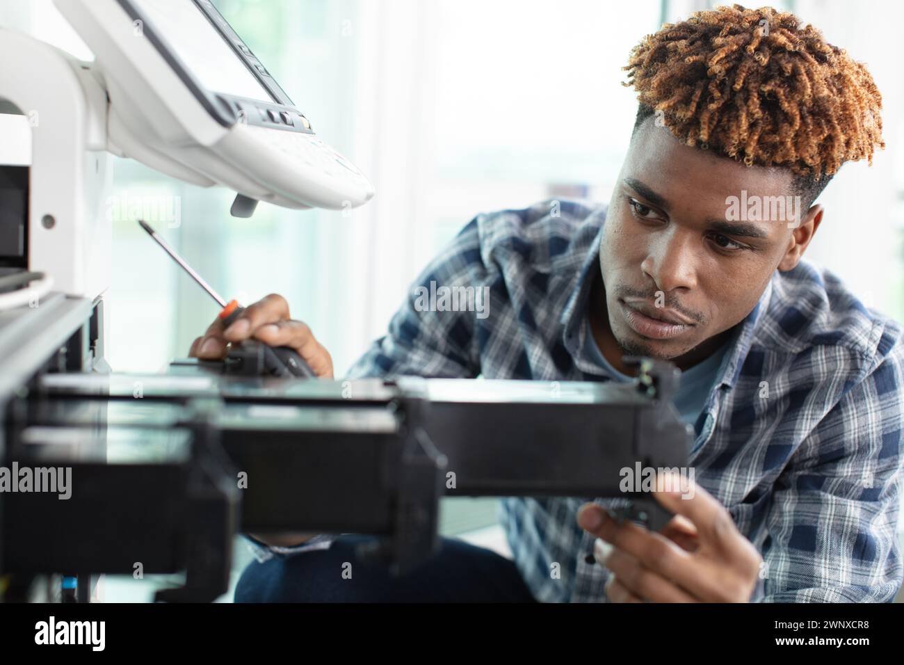 Man repairing printer work hi-res stock photography and images - Alamy