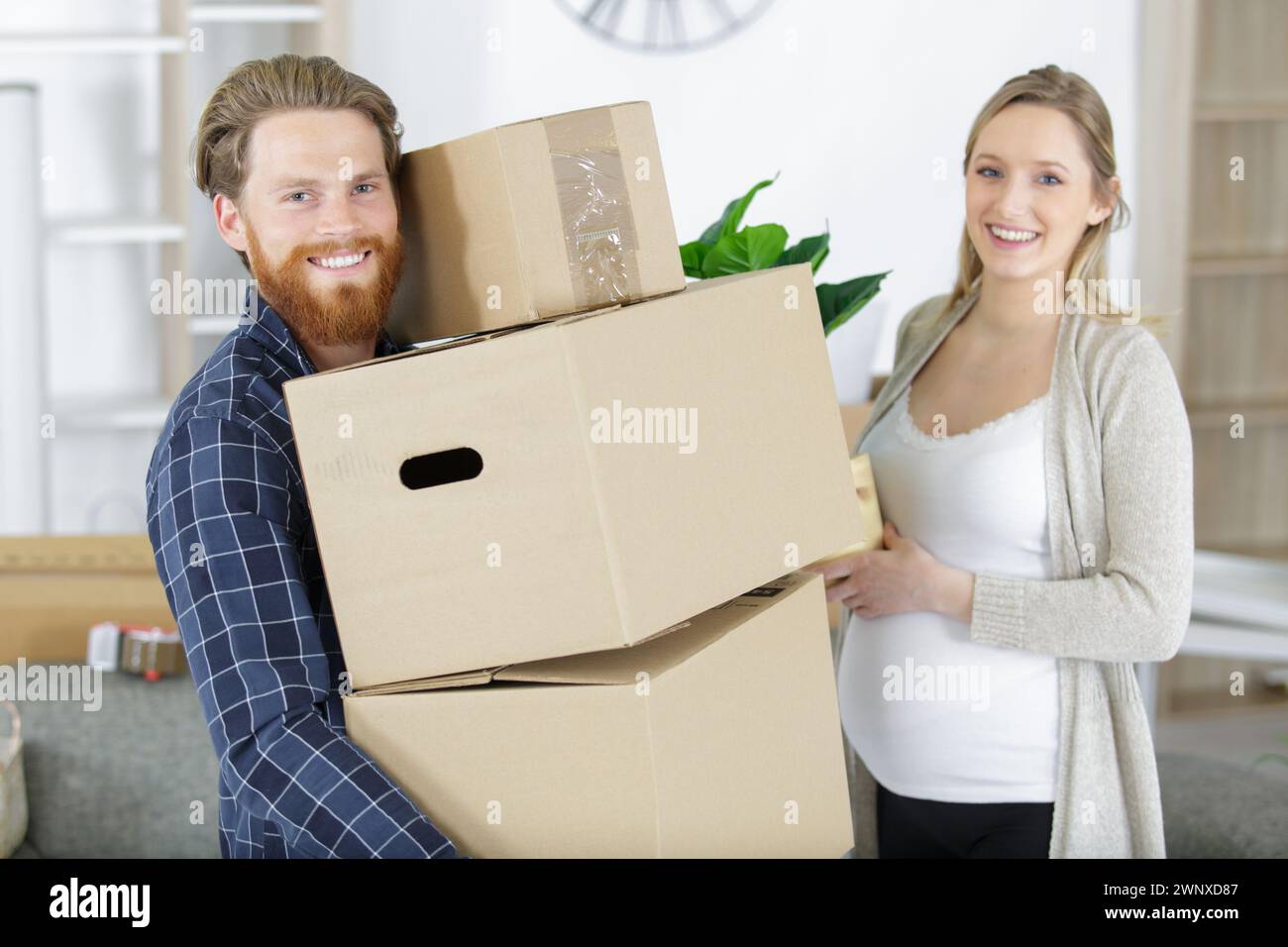 happy couple expecting baby moving houses Stock Photo - Alamy