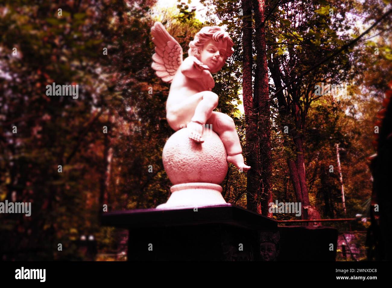 Angel in the cemetery monument at the grave of a child sculpture in the ...