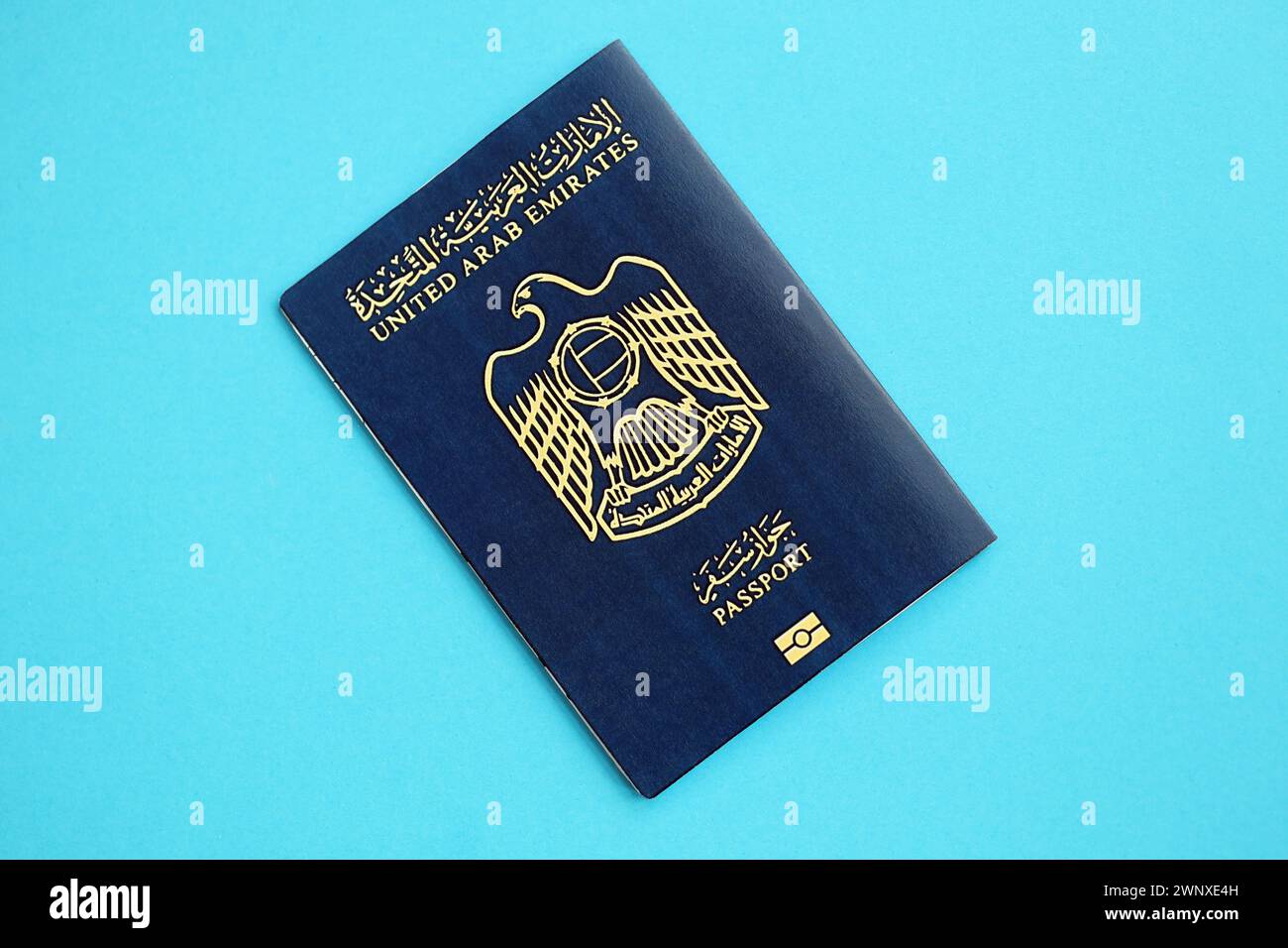 Blue United Arab Emirates passport on blue background close up. Tourism ...