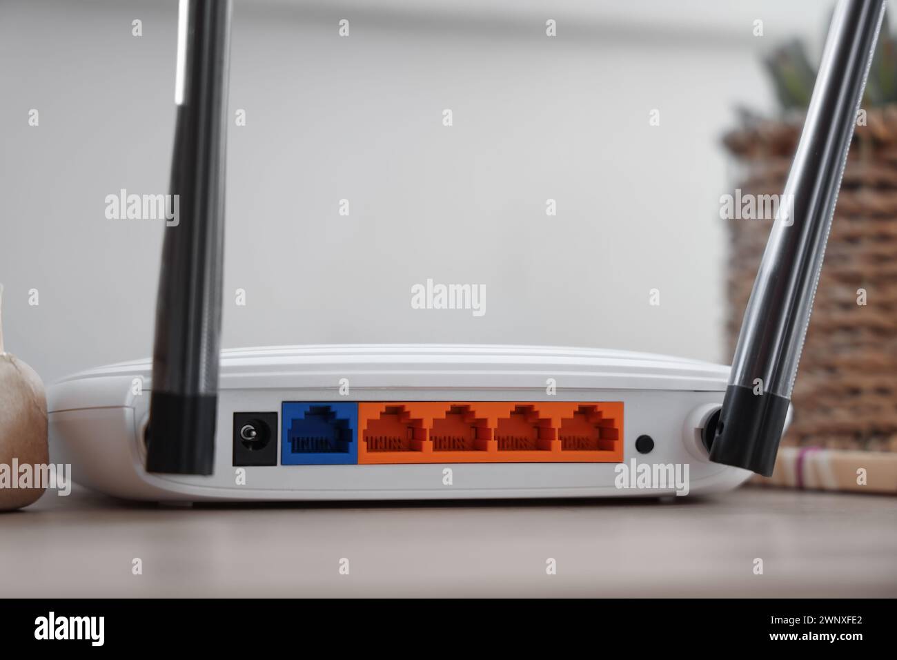 Modern wi-fi router on shelf in room, closeup Stock Photo - Alamy