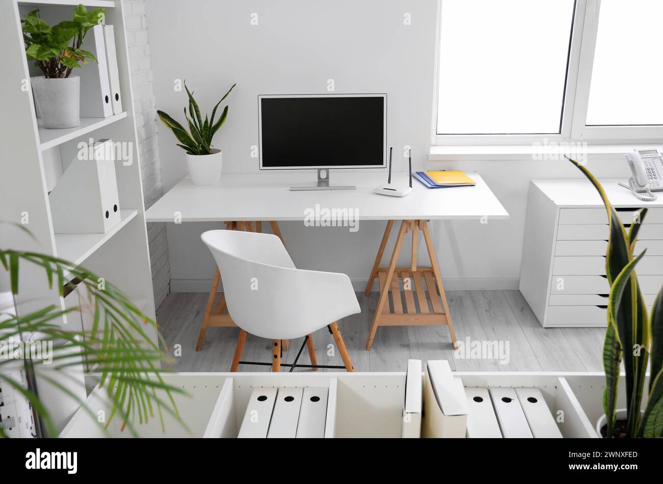 Workplace with blank computer and wi-fi router in office Stock Photo ...