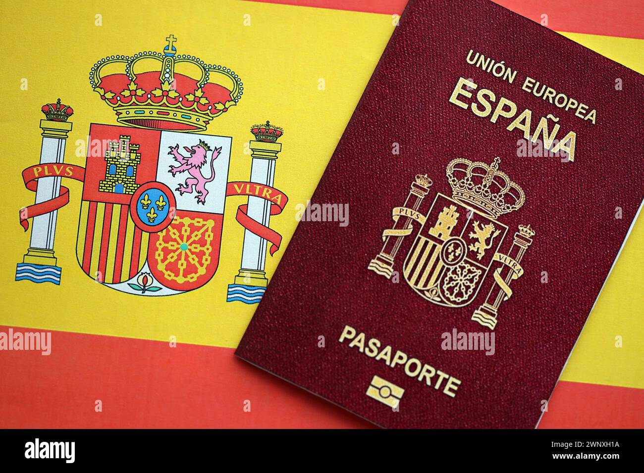 Red Spanish passport of European Union on national flag background ...