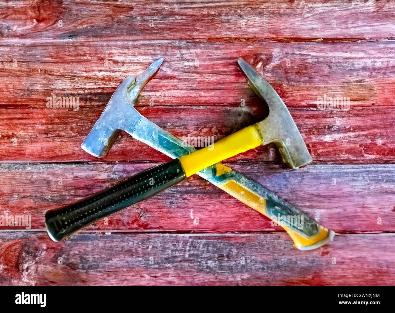 Two hammers on wooden background, tinted image, close-up Stock Photo ...