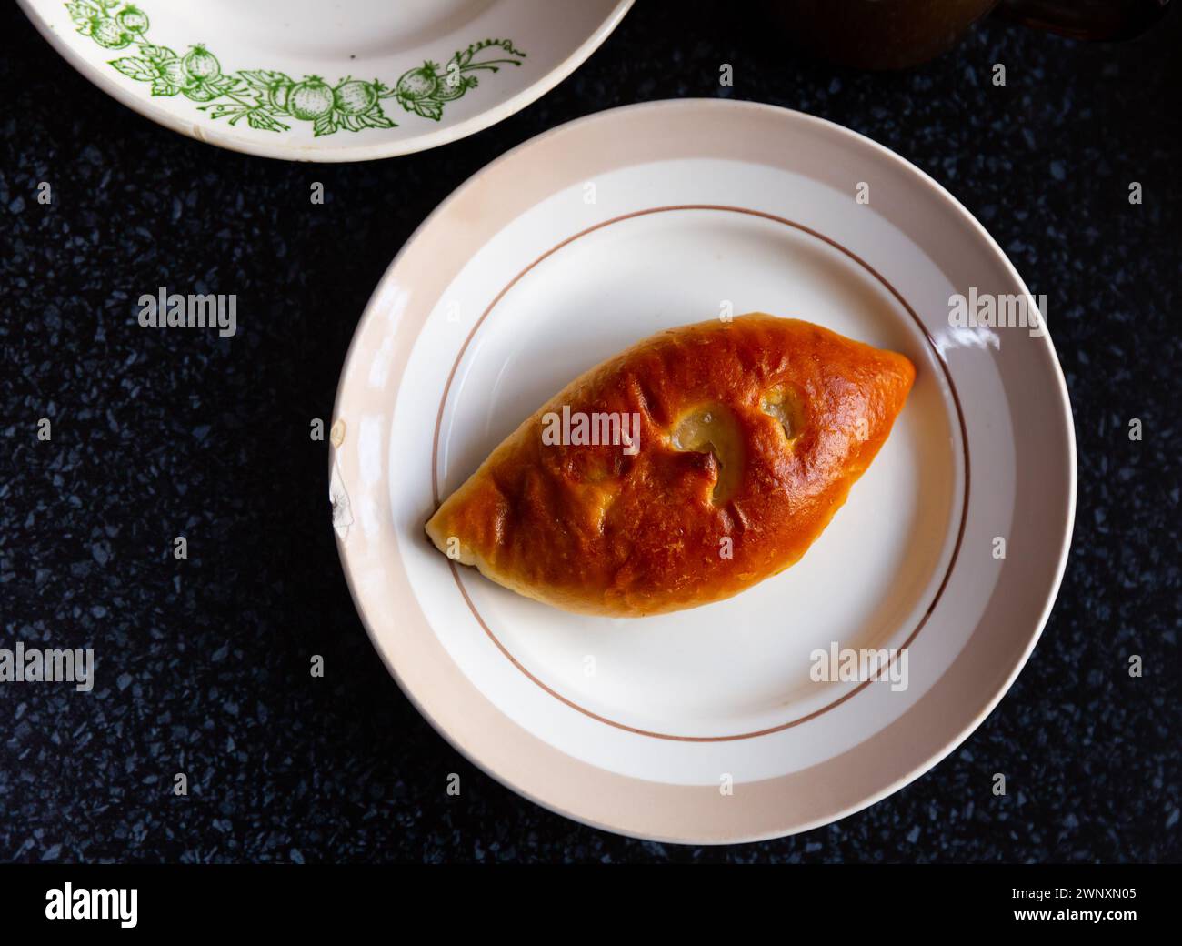 Traditional Russian baked pastry pirozhok at eatery Stock Photo - Alamy