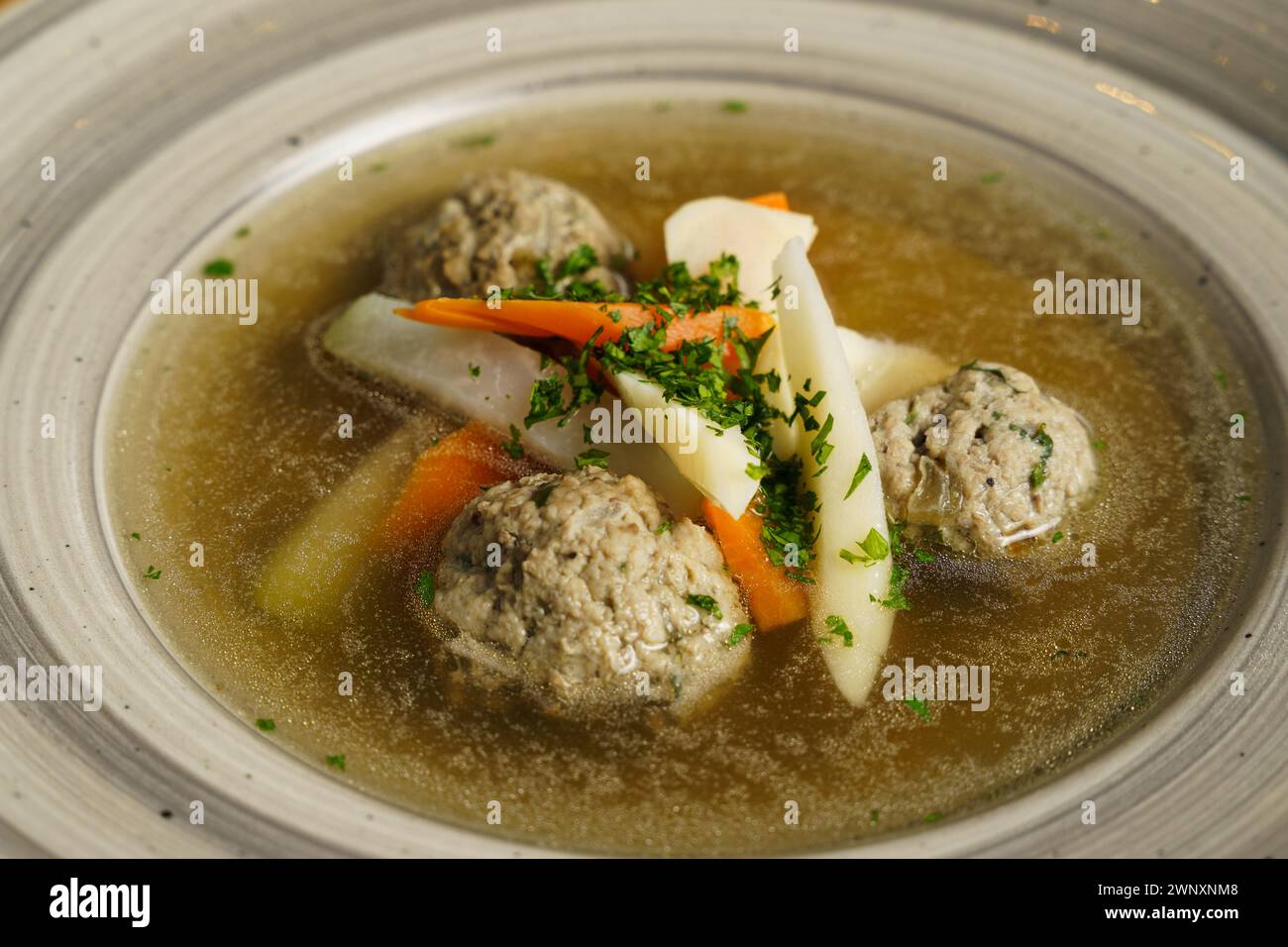 Goose soup, consommé with dumplings and vegetables Stock Photo - Alamy