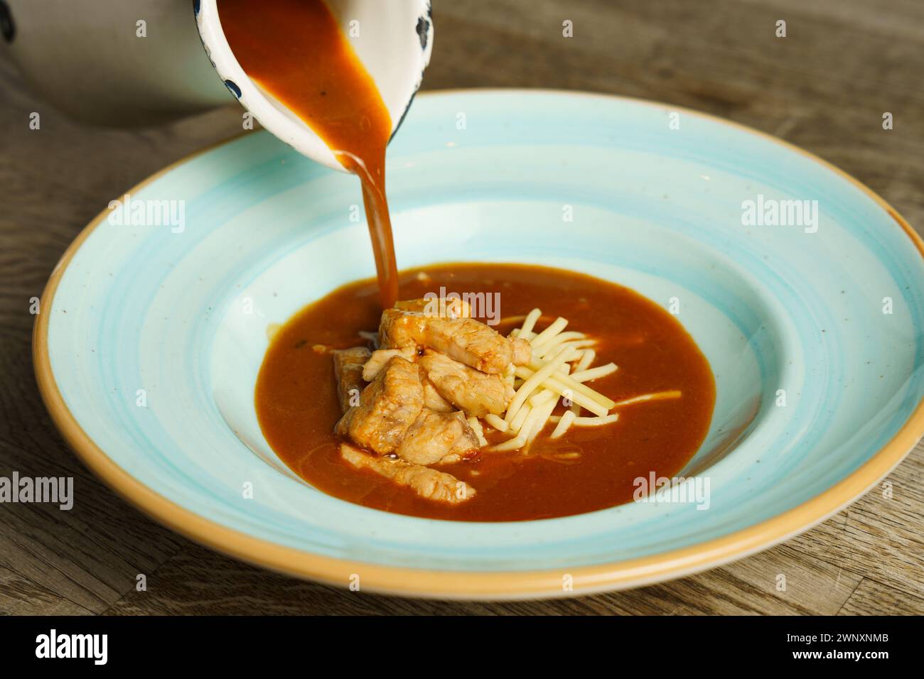 Hungarian fish soup with catfish Stock Photo - Alamy