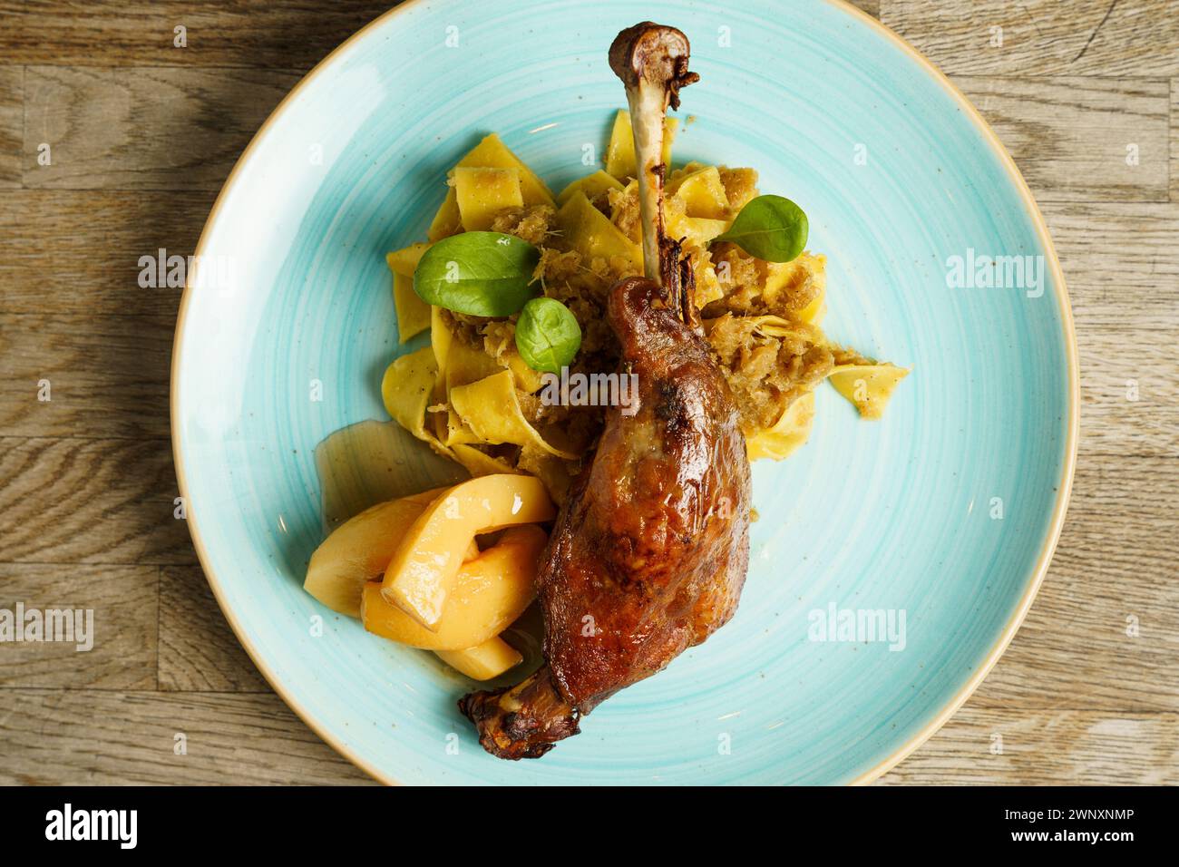 Roasted goose leg with cabbage papardelle pasta and quince compote ...