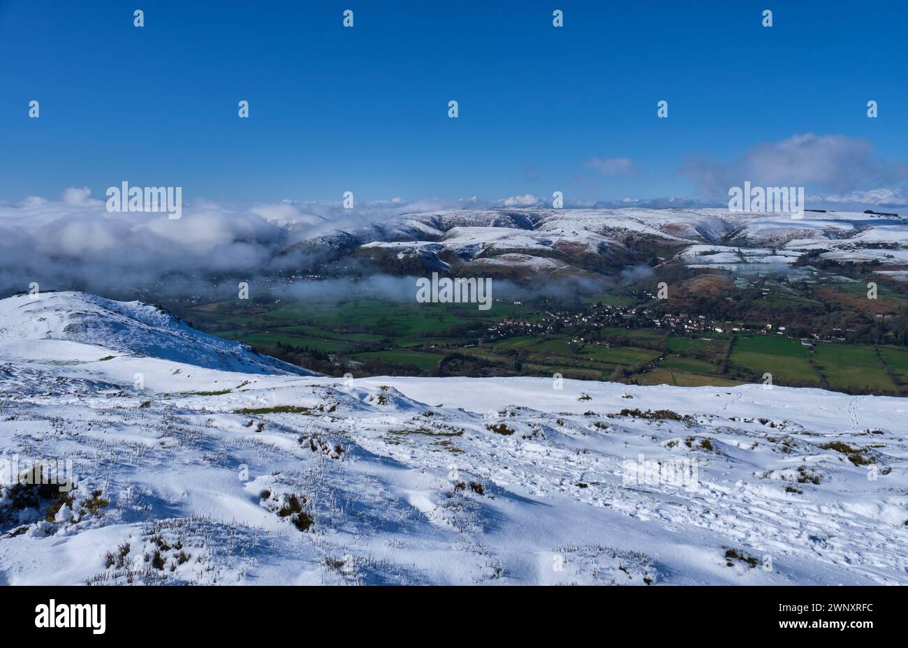 Snow on the Long Mynd with mist in the Stretton Valley, overlooking All ...