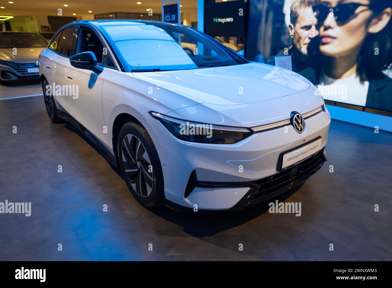 new white electric Volkswagen ID.7 five-door car, Liftback in showroom ...