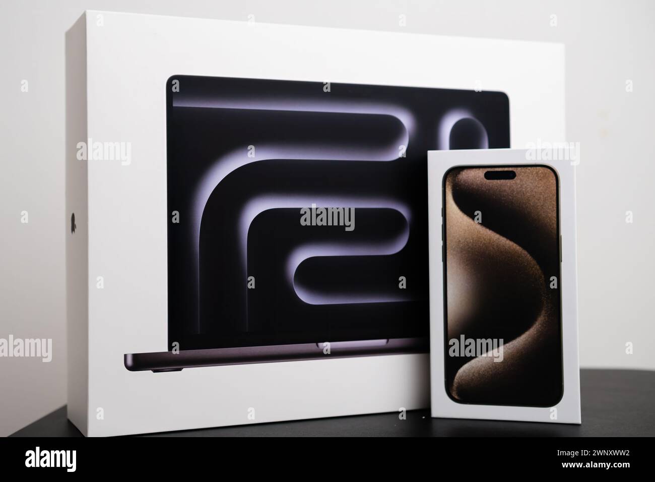 BERLIN , GERMANY - FEBRUARY 14 2024: New MacBook Pro and iPhone Pro Max ...