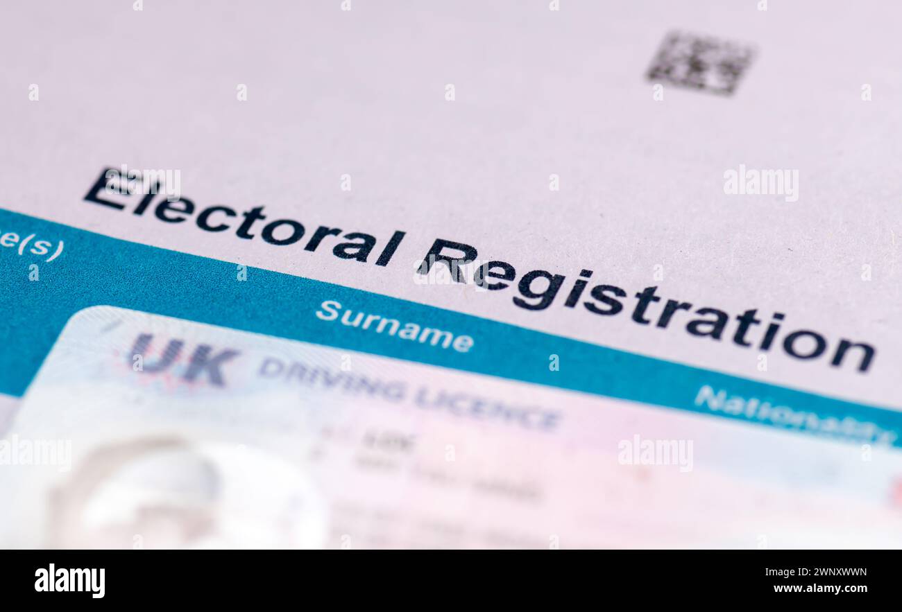 Macro close up of an Electoral Registration and a driving licence. An ...