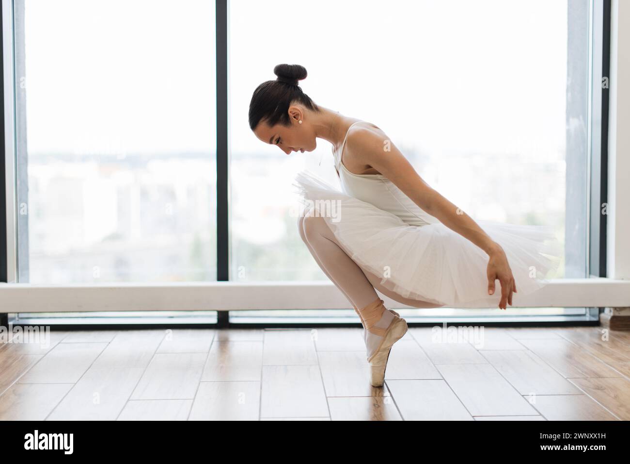 Classical Caucasian Ballet dancer side view Stock Photo - Alamy