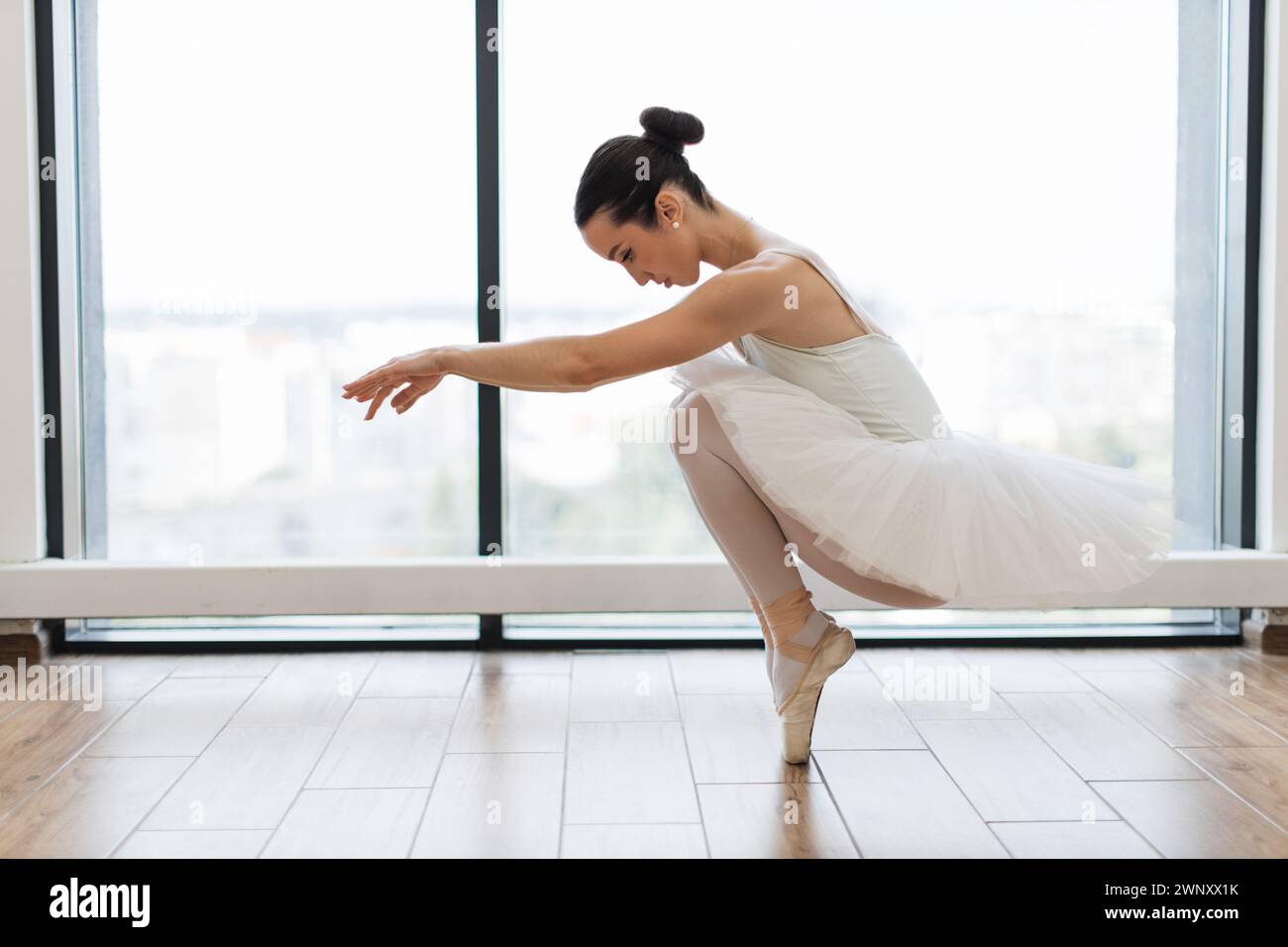 Classical Caucasian Ballet dancer side view Stock Photo - Alamy
