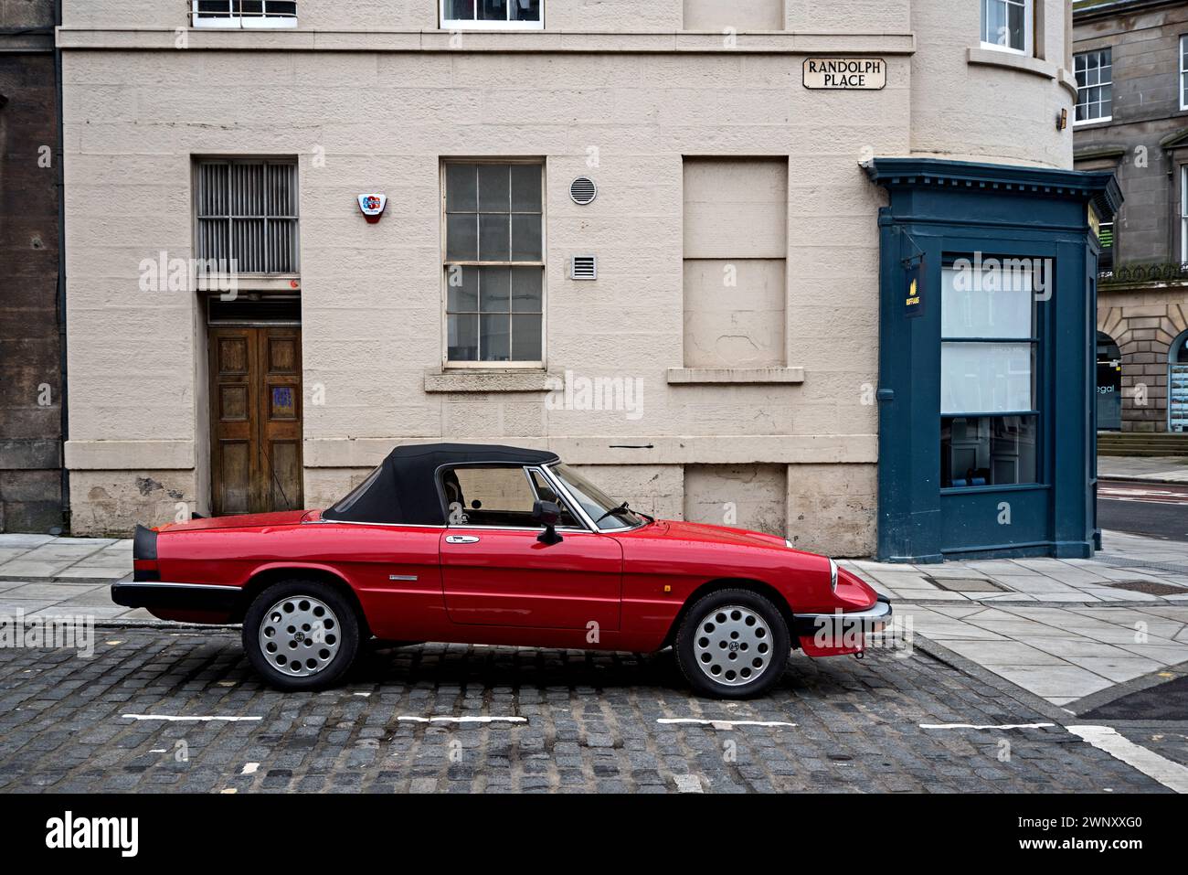 Red 1990 Alpha Romeo, parked in Randolph Place in Edinburgh's West End ...