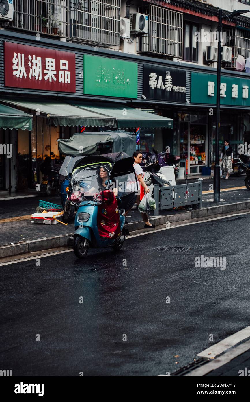 scooter on the streets of Suzhou Stock Photo - Alamy