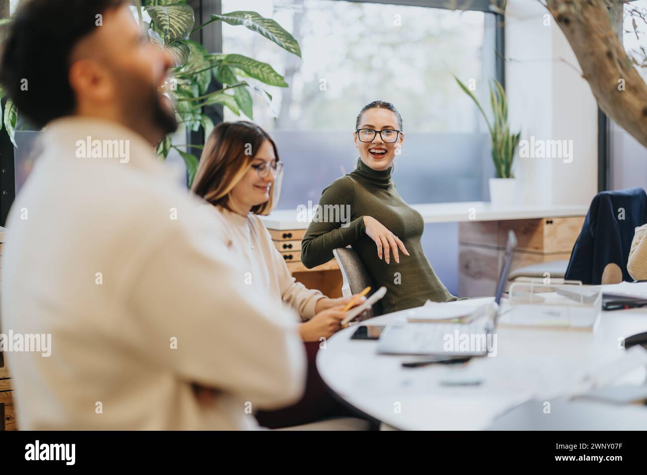 Successful multi generational group collaborating and brainstorming ...